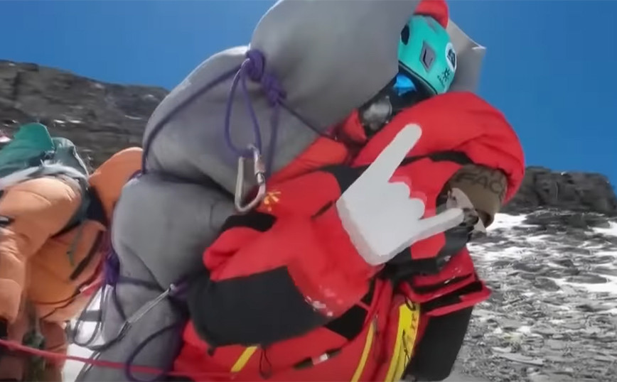Shocking rescue of climber in Everest 'death zone' - 'We carried him on ...