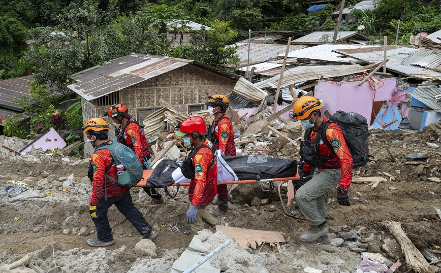 Philippines: At least 11 dead and 110 missing from landslide - Rescuers dig in mud with bare ...