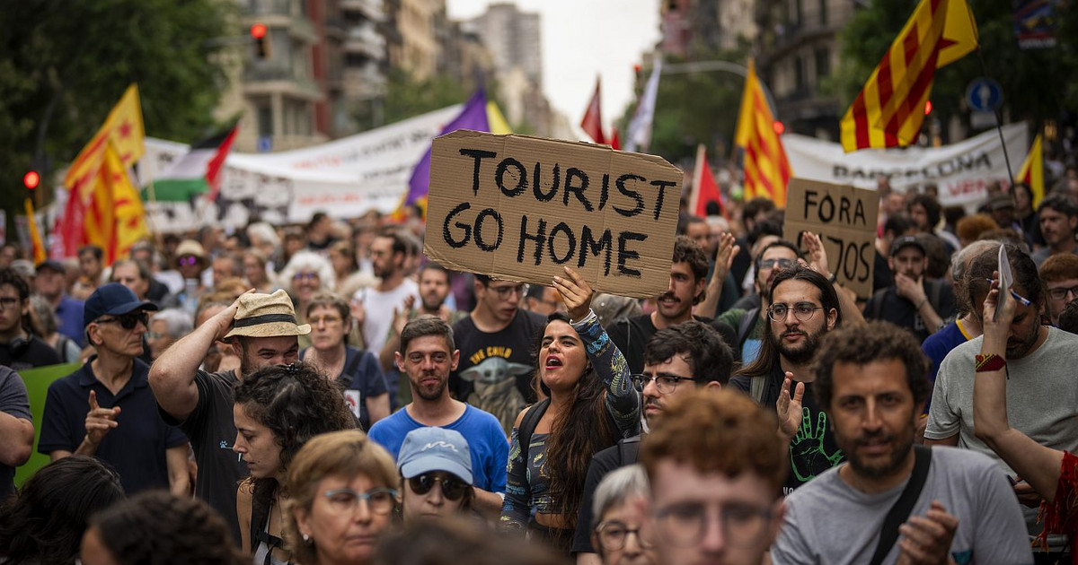 "Arrives! Let's put limits on tourism': Thousands protest against ...
