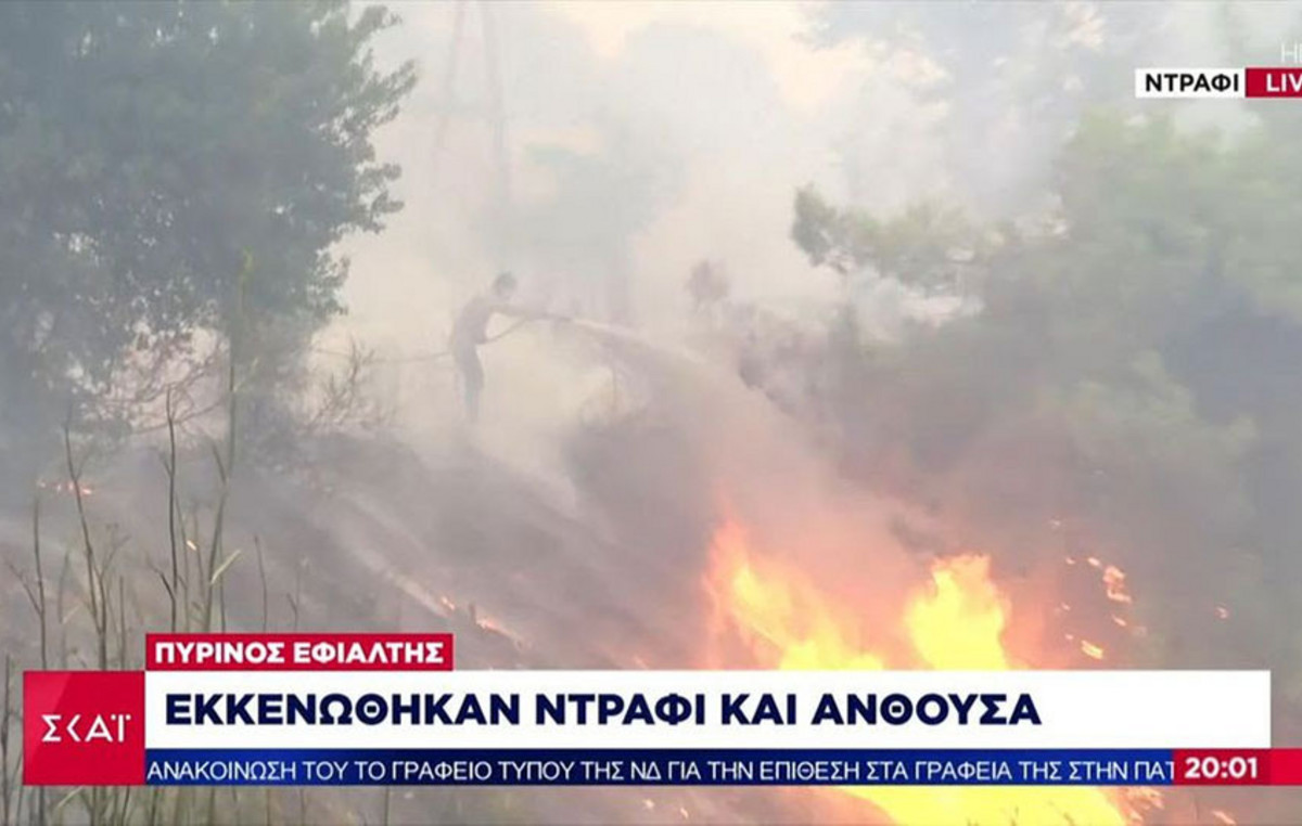 Φωτιά στην Πεντέλη: Κάτοικος προσπαθεί με λάστιχο να βοηθήσει την ...